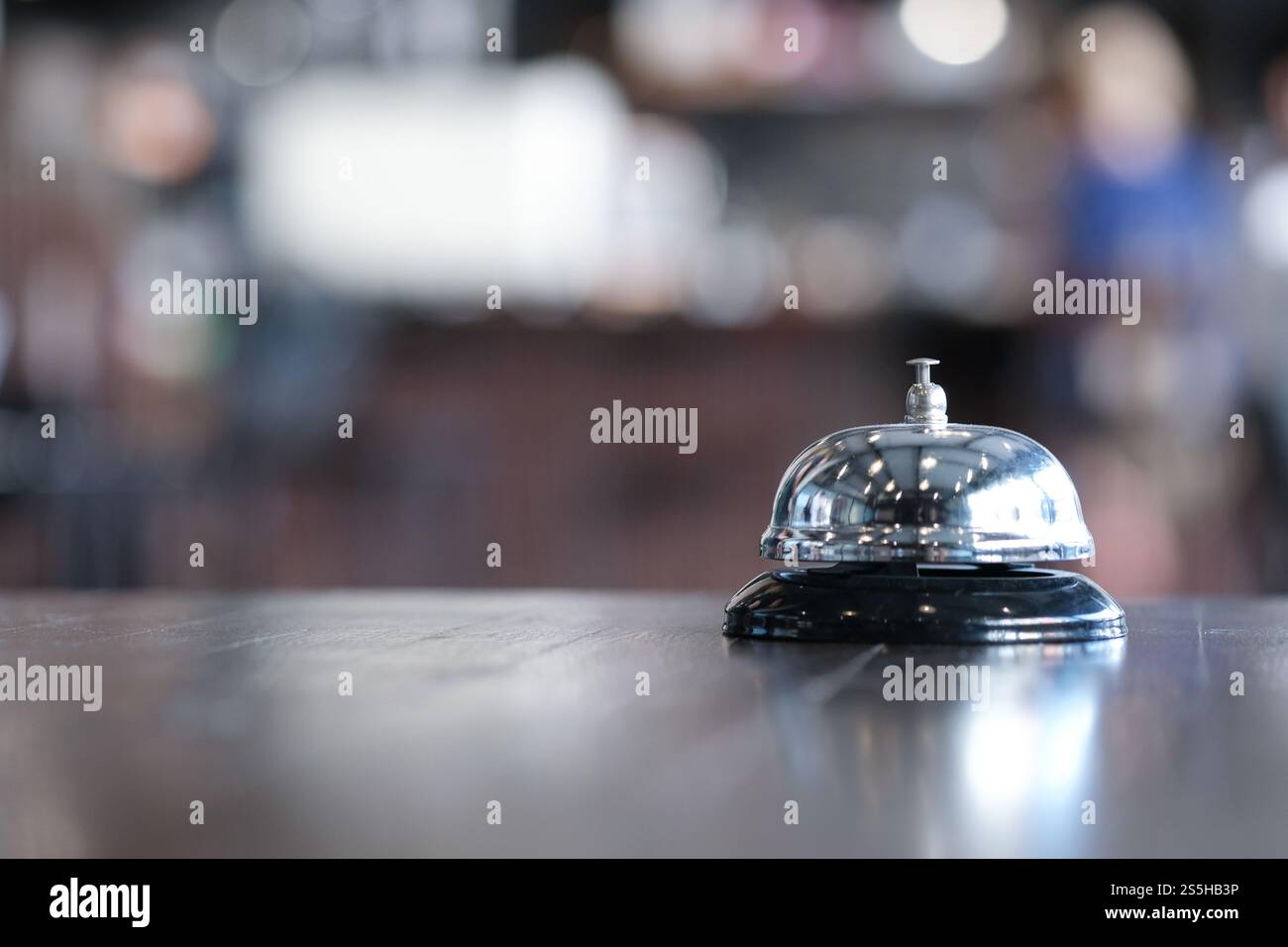 Hotel reception counter desk with service bell Stock Photo - Alamy