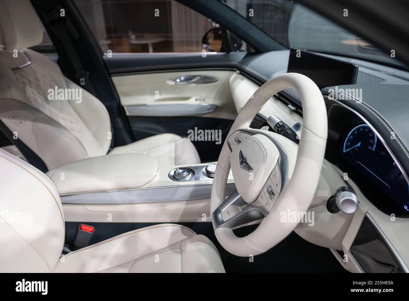 Genesis GV70 car interior, steering wheel, driver and passenger seating ...