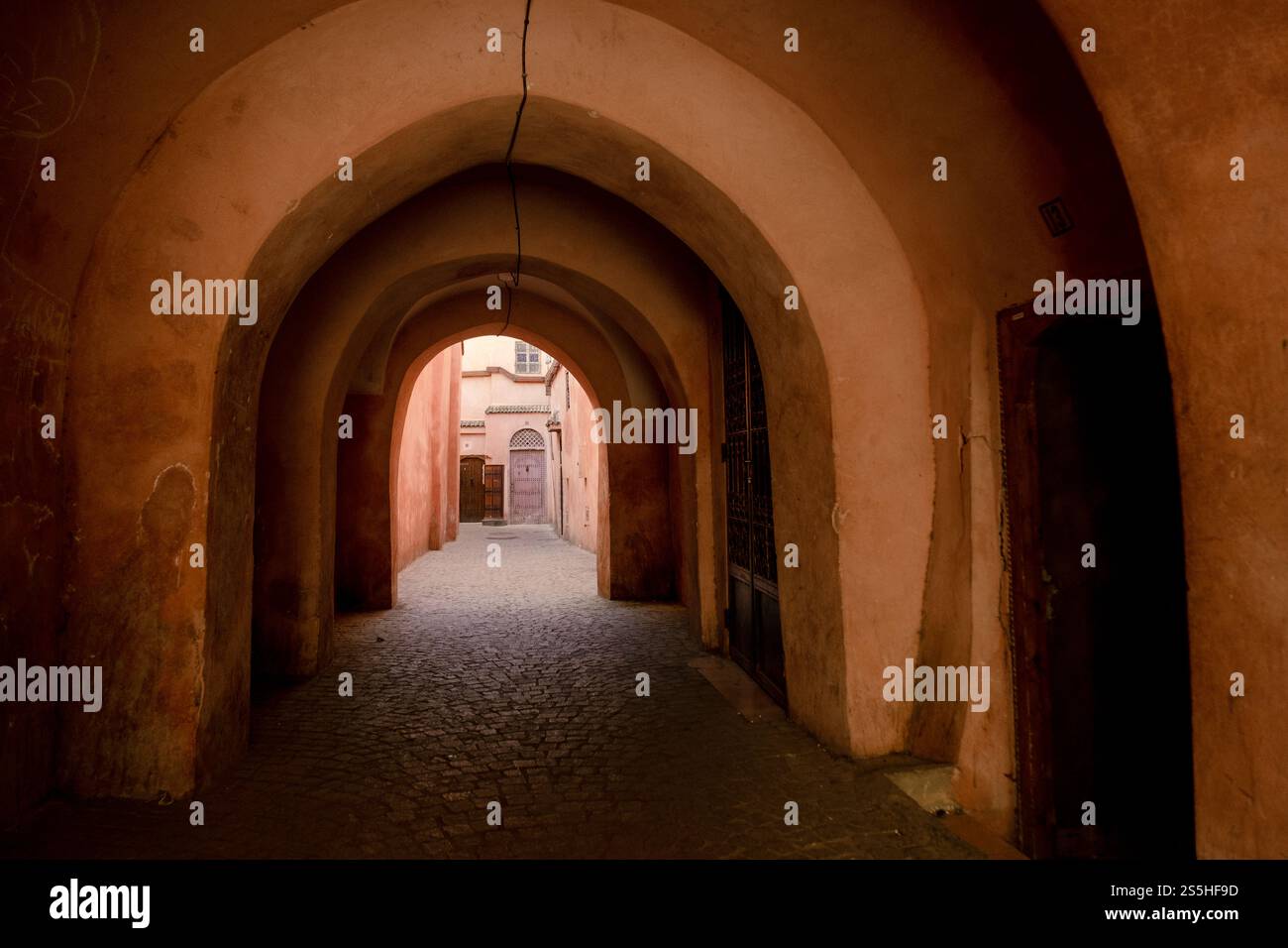 Tunnel of moorish arches in the streets of the Marrakech Medina in ...