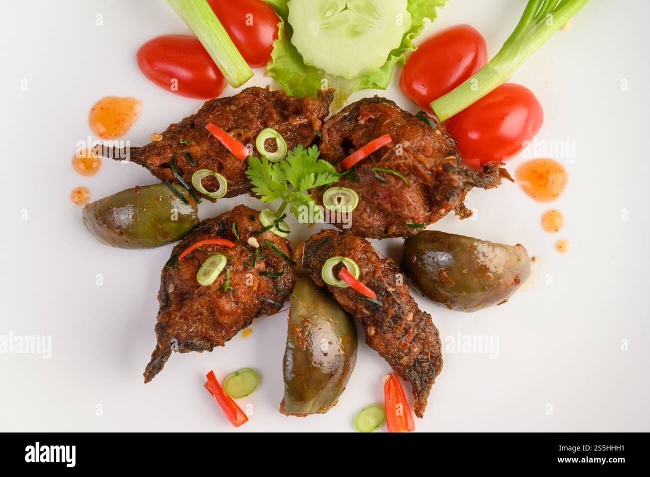 Spicy Fried Stir Catfish on white plate, Thai food. Top view Stock ...