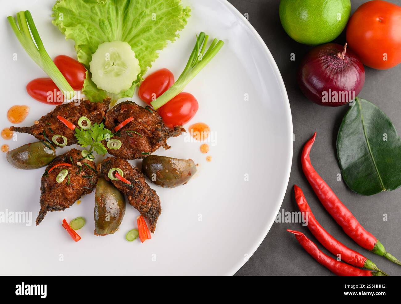 Spicy Fried Stir Catfish on white plate, Thai food. Top view Stock ...