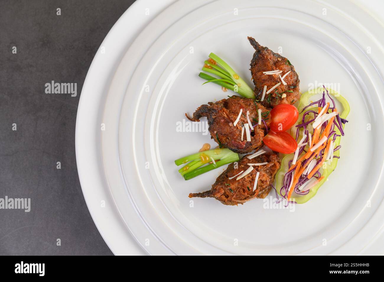 Spicy Fried Stir Catfish on white plate, Thai food. Top view Stock ...