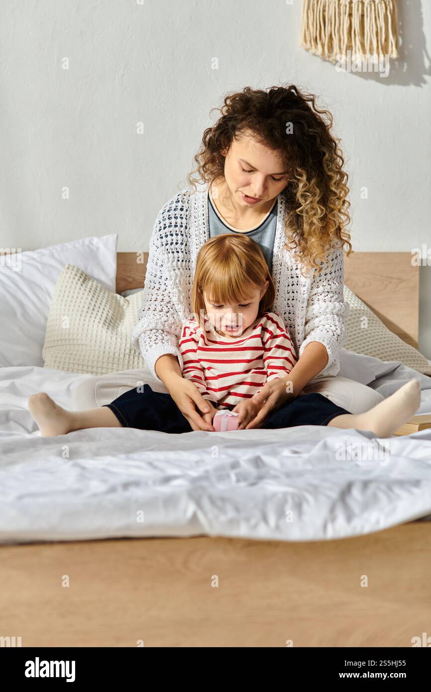 A mother and daughter enjoy a joyful moment together, bonding through ...