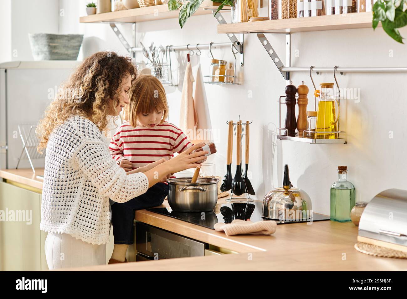 A mother teaches her daughter to cook, bonding over a shared task in ...