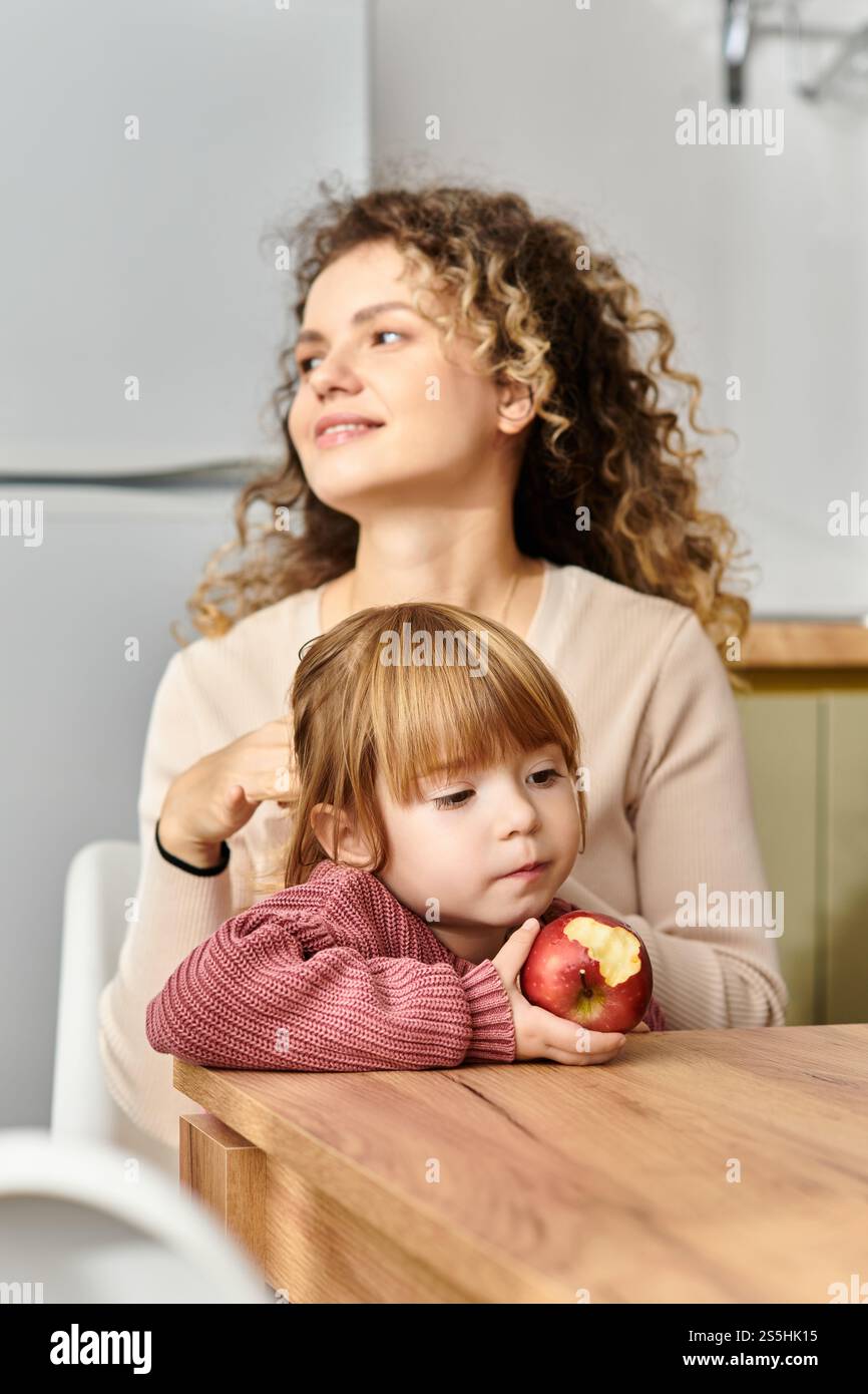 Mother and daughter share a delightful afternoon at home, relaxing and ...
