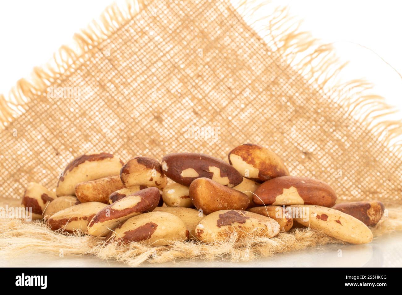 Brazil nuts without shells with jute napkin, close-up, isolated on ...