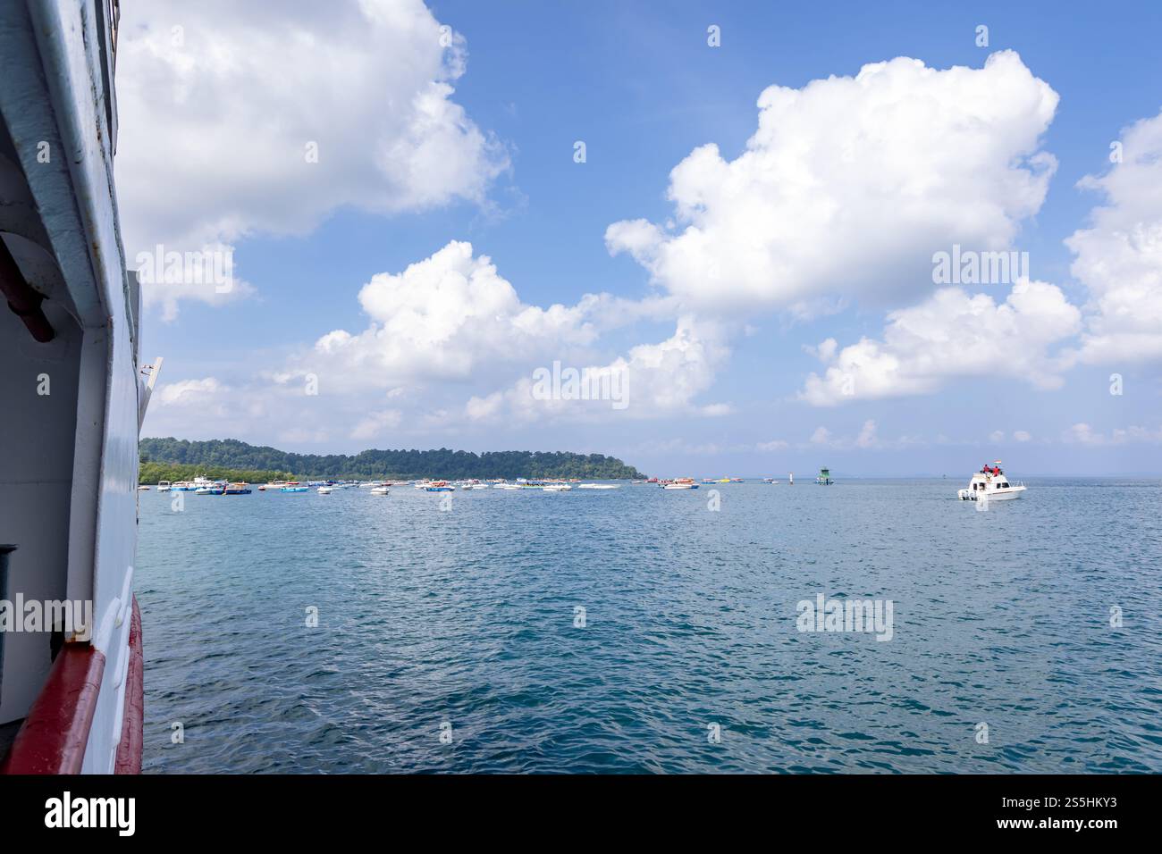 small ships anchored at sea coast with bright blue sky at morning from ...