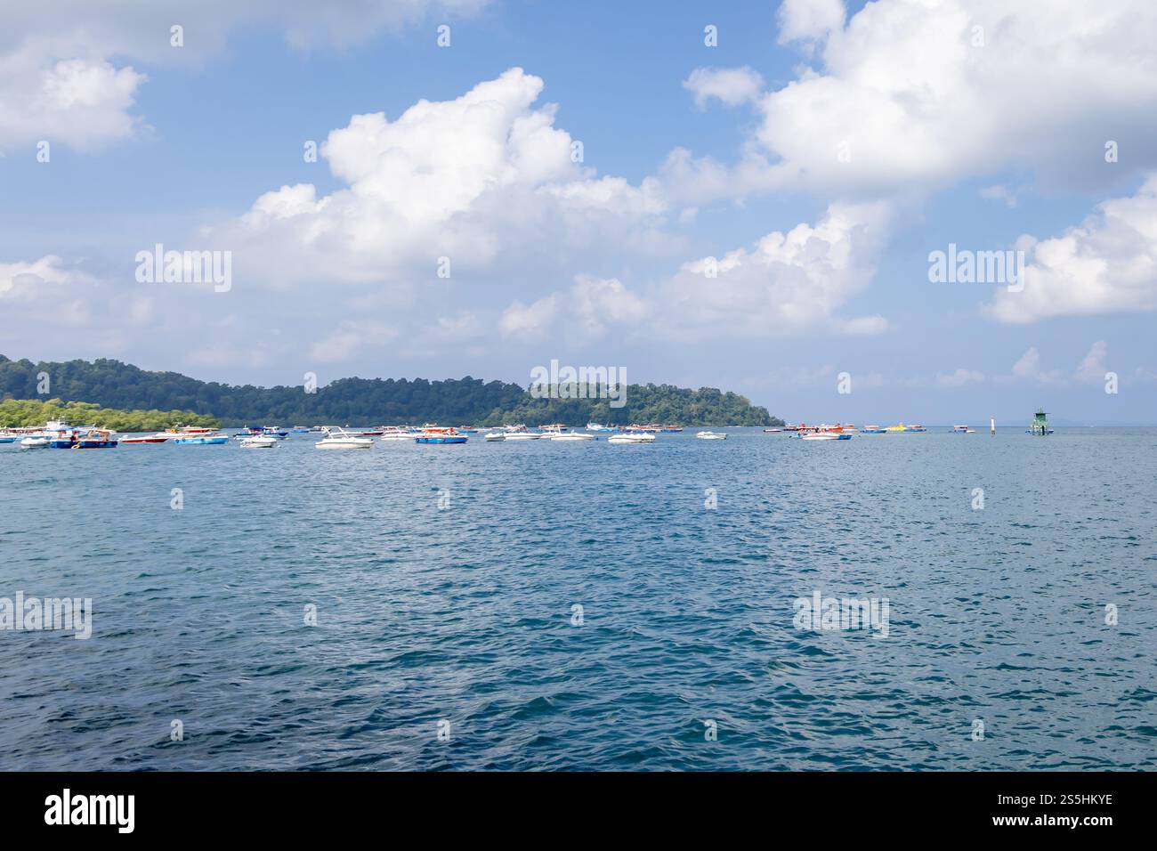 small ships anchored at sea coast with bright blue sky at morning from ...