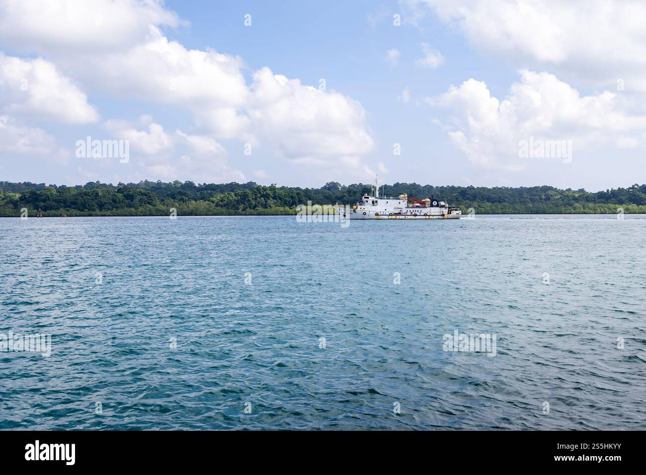 small ships anchored at sea coast with bright blue sky at morning from ...