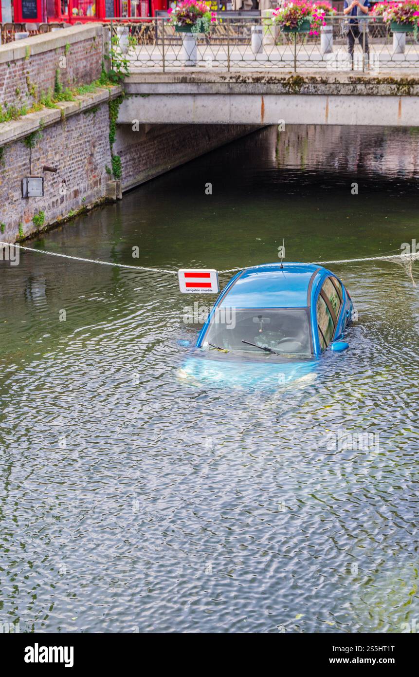 Blue car drown in water canal. Extreme accident vehicle sink in river ...