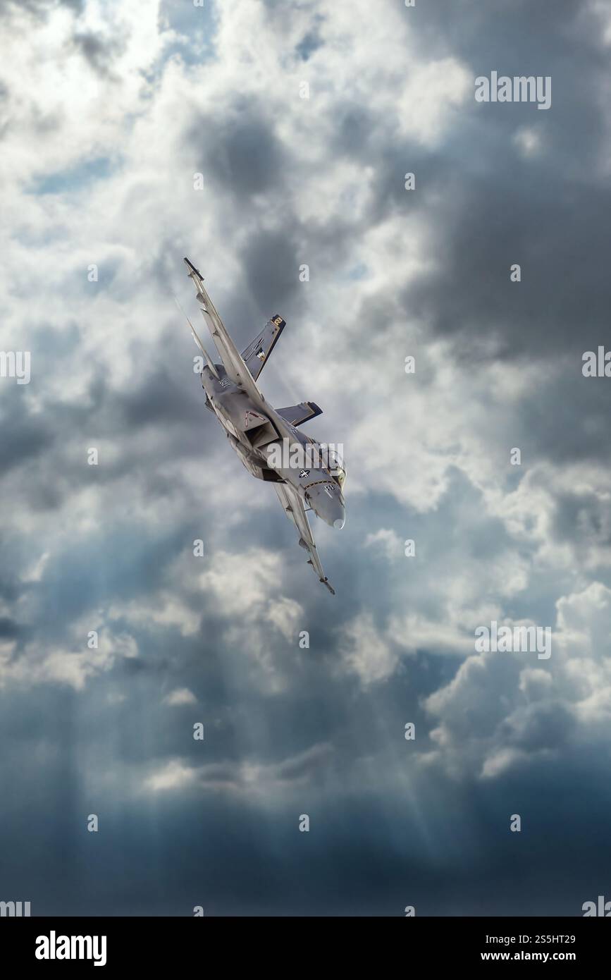 American fighter jet flying in a dramatic sky Stock Photo - Alamy