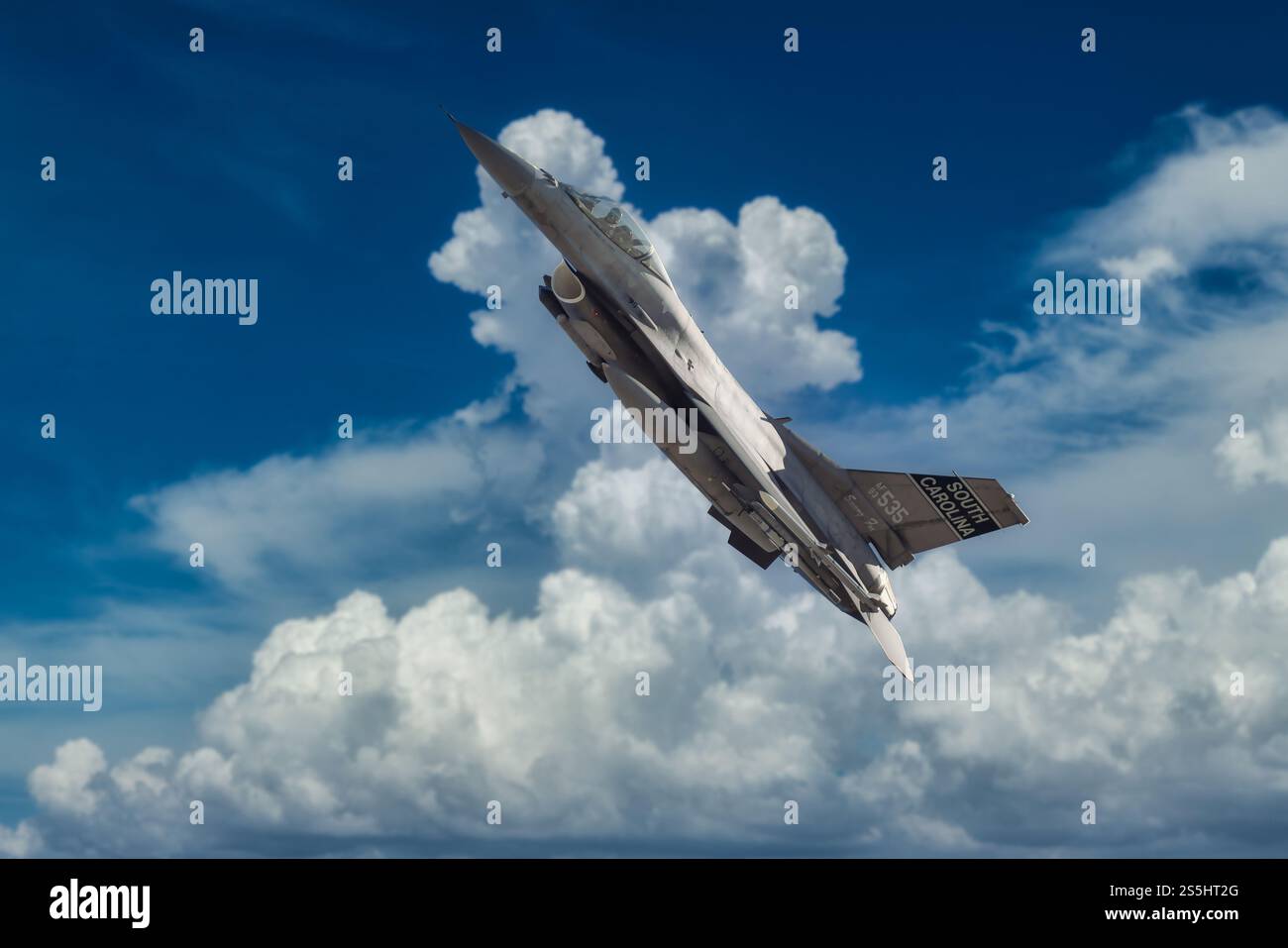 American fighter jet flying in a dramatic sky Stock Photo - Alamy