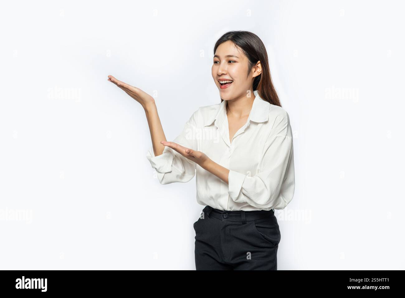 The girl in a white shirt and the open hand sign on the right Stock ...