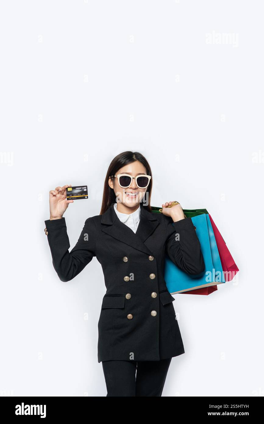 Women in black wear glasses, go shopping, carry credit cards, and lots ...