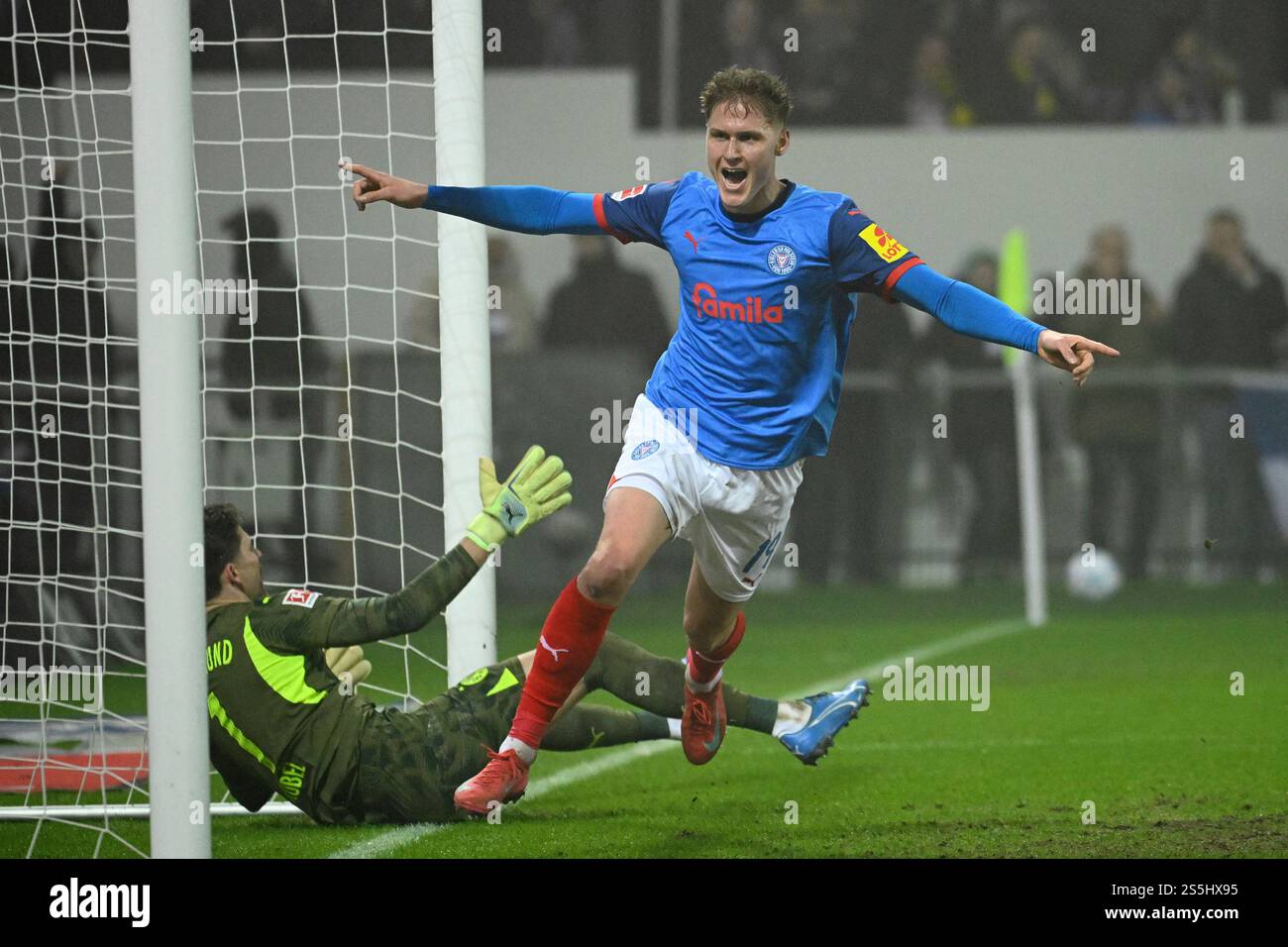 Kiel's Phil Harres celebrates after scoring his side's second during ...