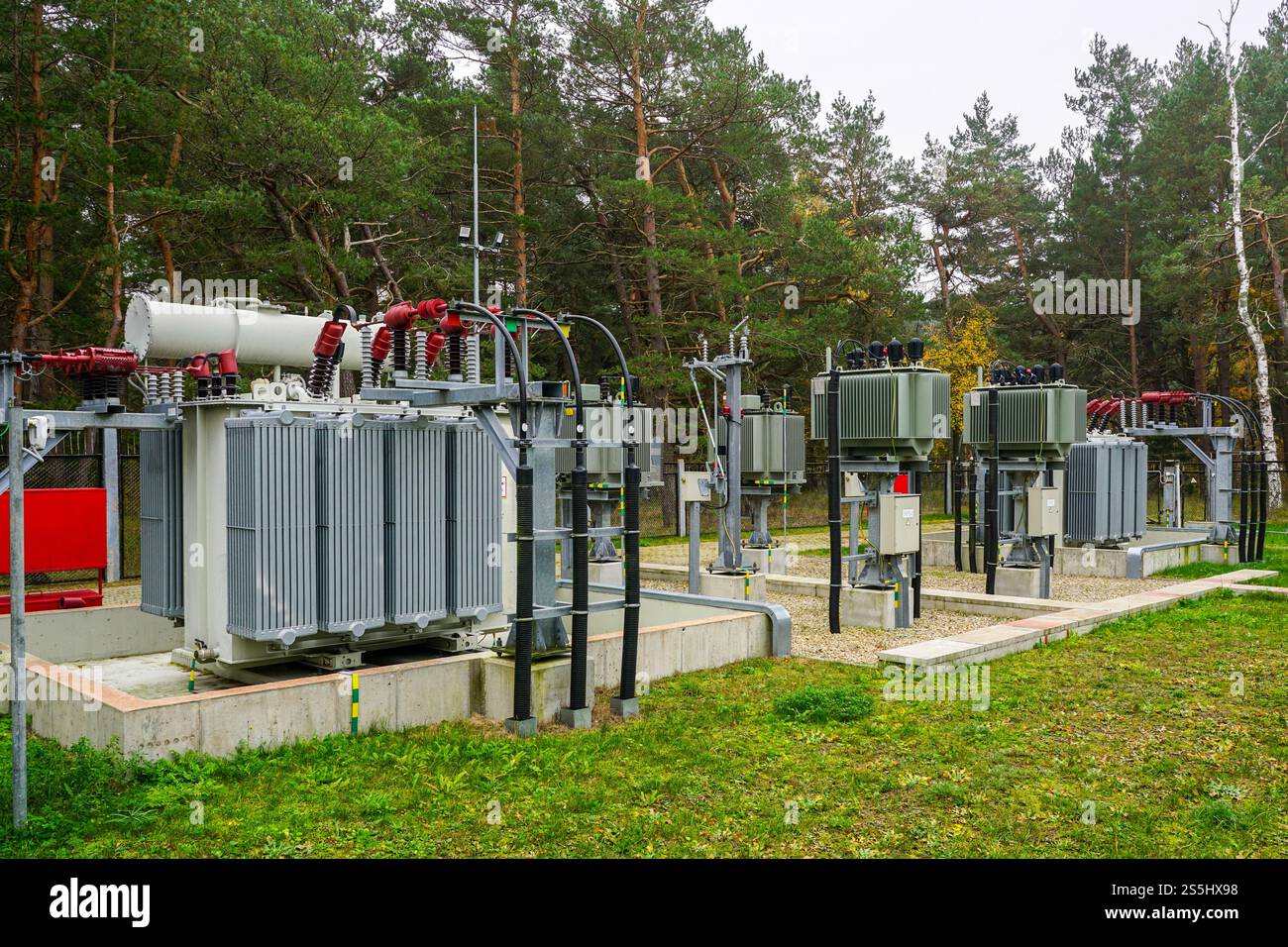 Modern electrical equipment in an outdoor electrical substation, two ...