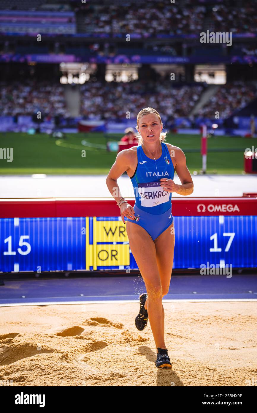 Dariya Derkach participating in the triple jump at the Paris 2024 ...