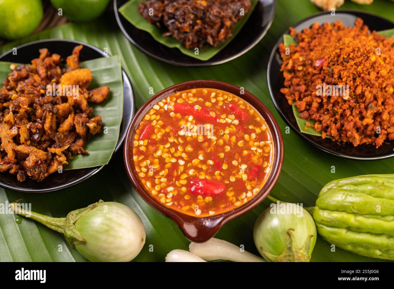 Different types of chili sauce in a cup with ingredients to make Stock ...
