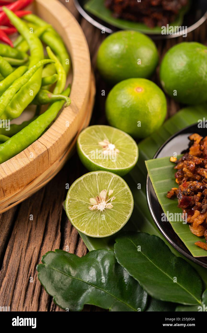 The lemon cut in half and the chili are placed on the ground Stock ...