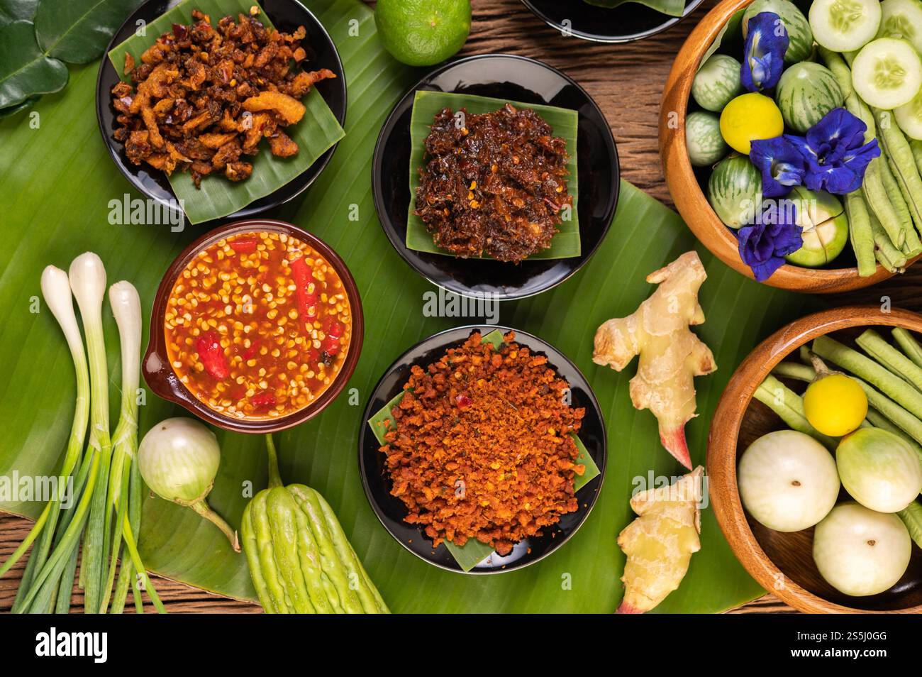 Different types of chili sauce in a cup with ingredients to make Stock ...