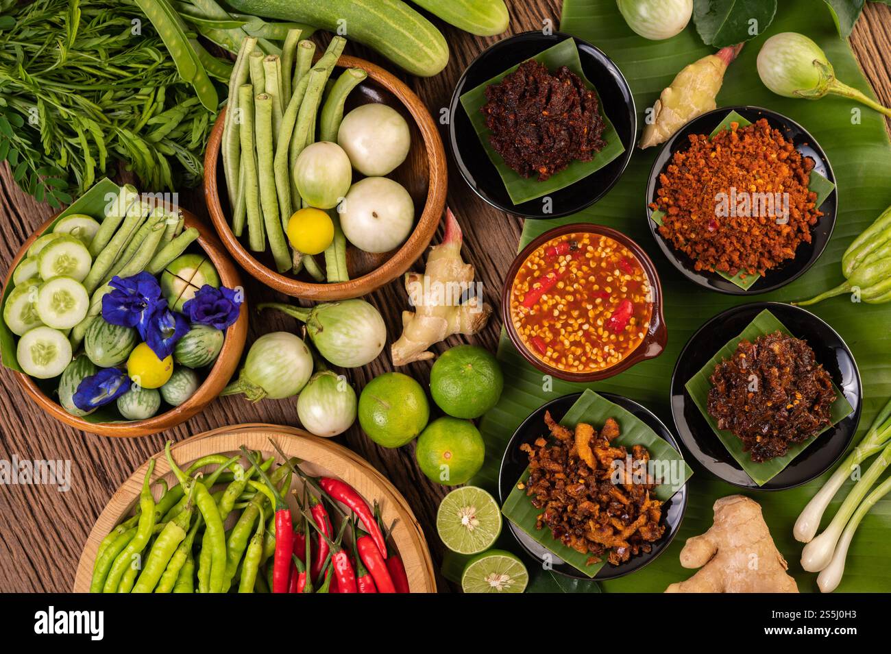 Different types of chili sauce in a cup with ingredients to make Stock ...