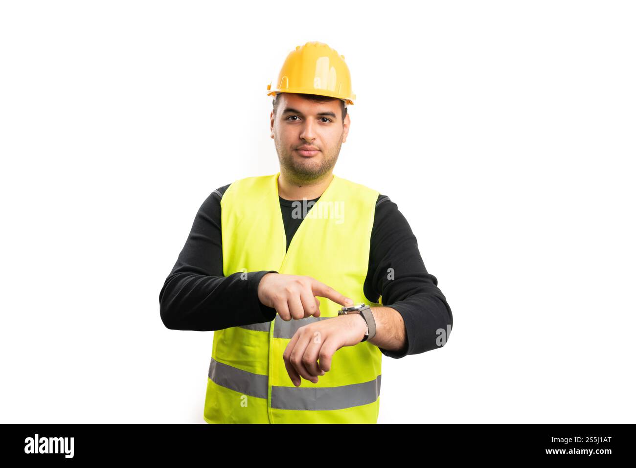 Male adult builder with serious expression wearing construction attire pointing index finger at ...