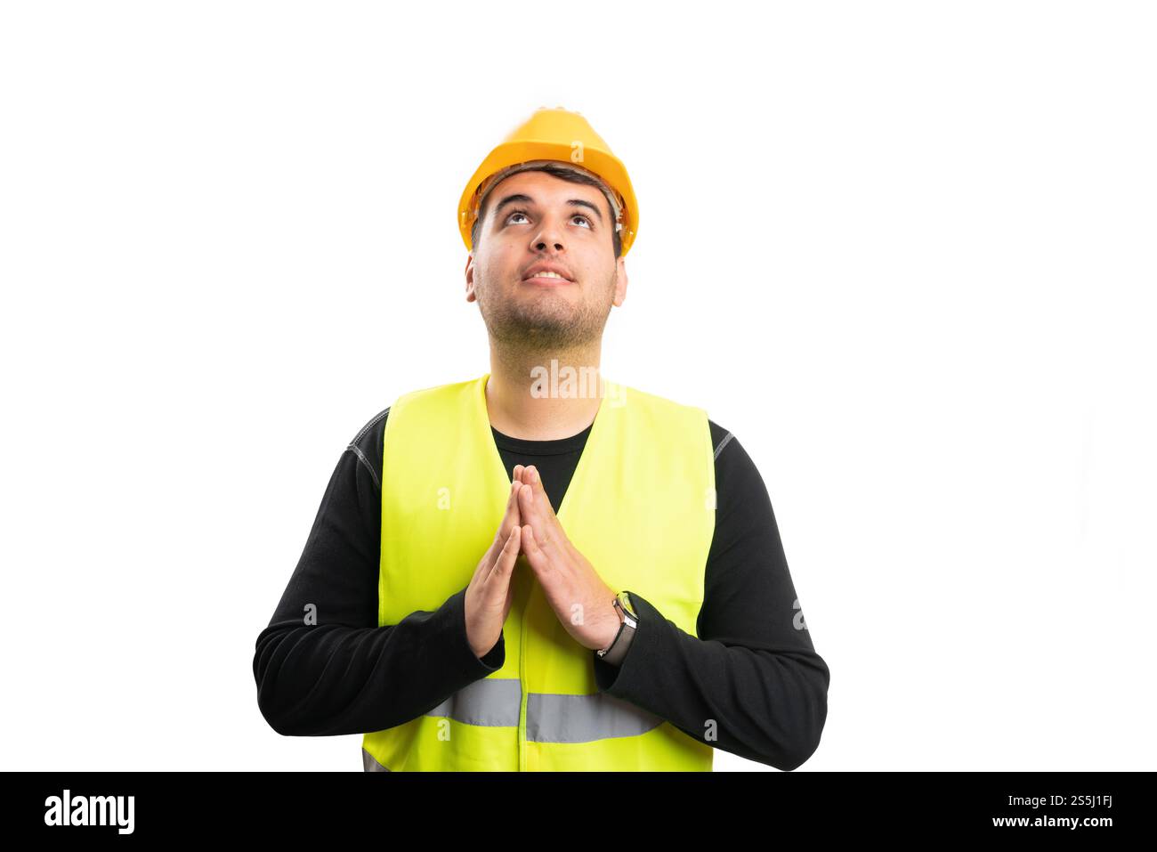 Faithful builder man in work equipment praying gesture looking up ...