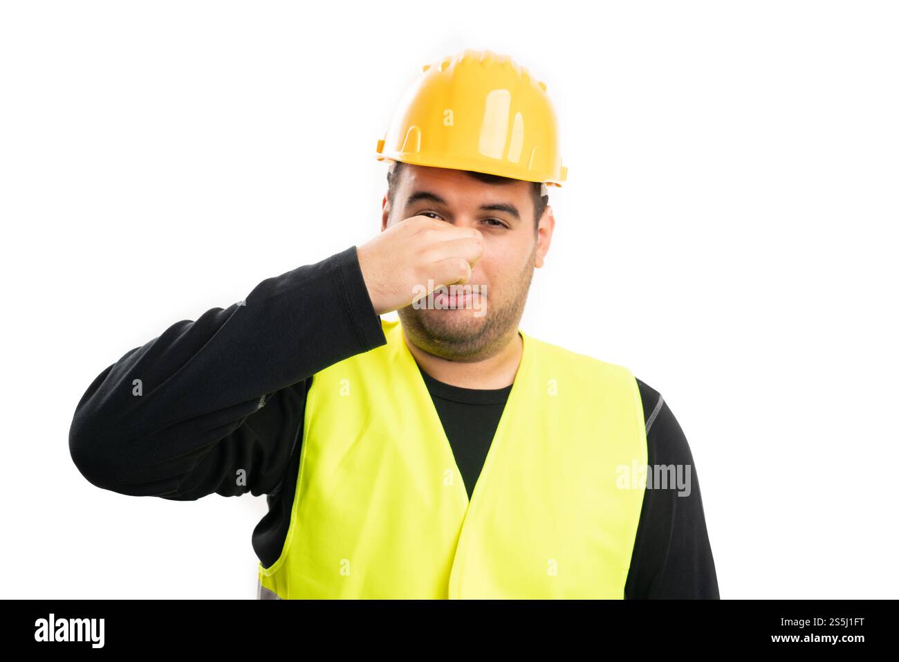 Male construction worker holding nose as bad smell stench concept ...