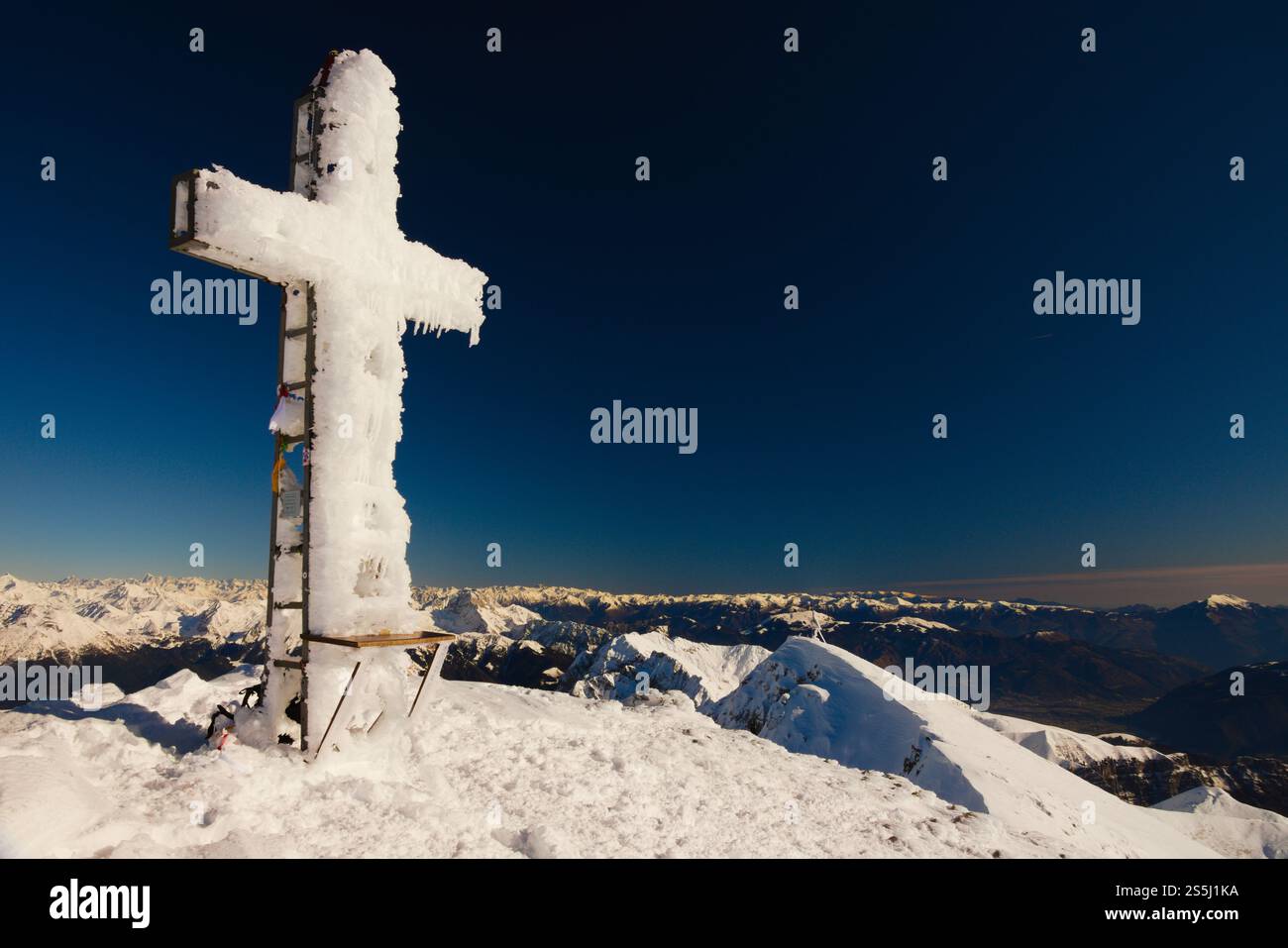 Frozen cross on the top of mount Pizzo Arera (2,512 metres - 8,241 ft ...