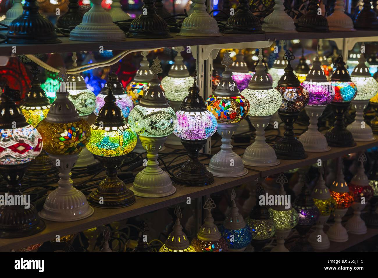 Colorful Turkish lights with mosaic shades stand in a row at the bazaar ...