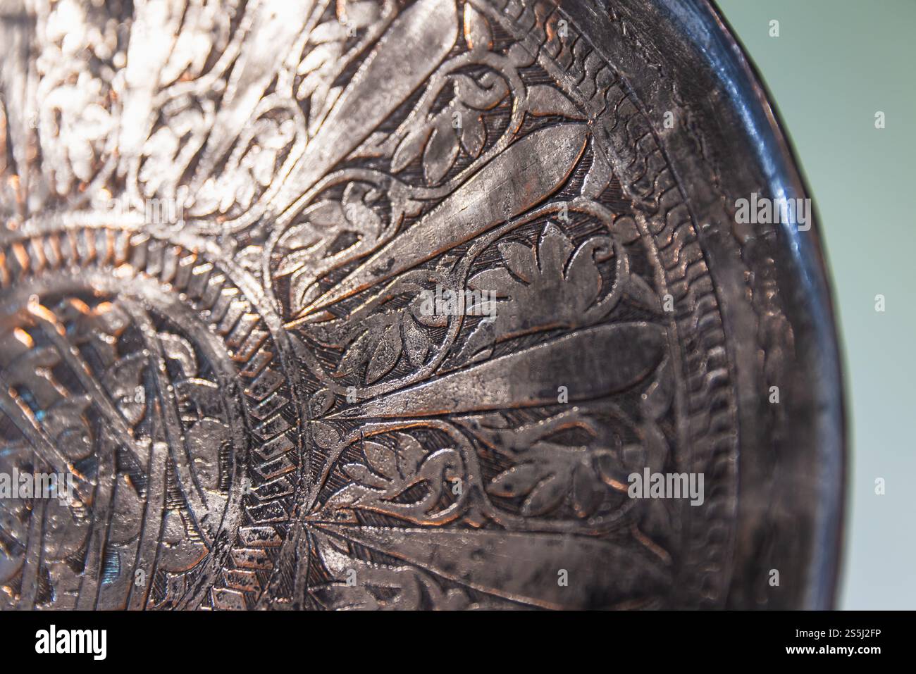 An ancient silver plate with embossed patterns is in antique shop in ...