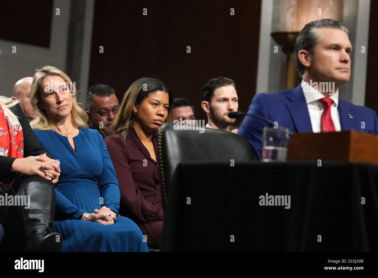Jennifer Rauchet listens with her husband Pete Hegseth, right ...