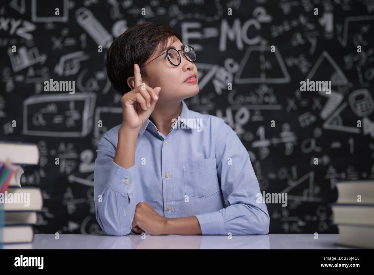 The teacher sat thinking about teaching in the classroom Stock Photo ...