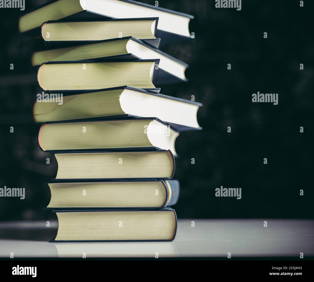 The books are placed in a stack of books on the table Stock Photo - Alamy