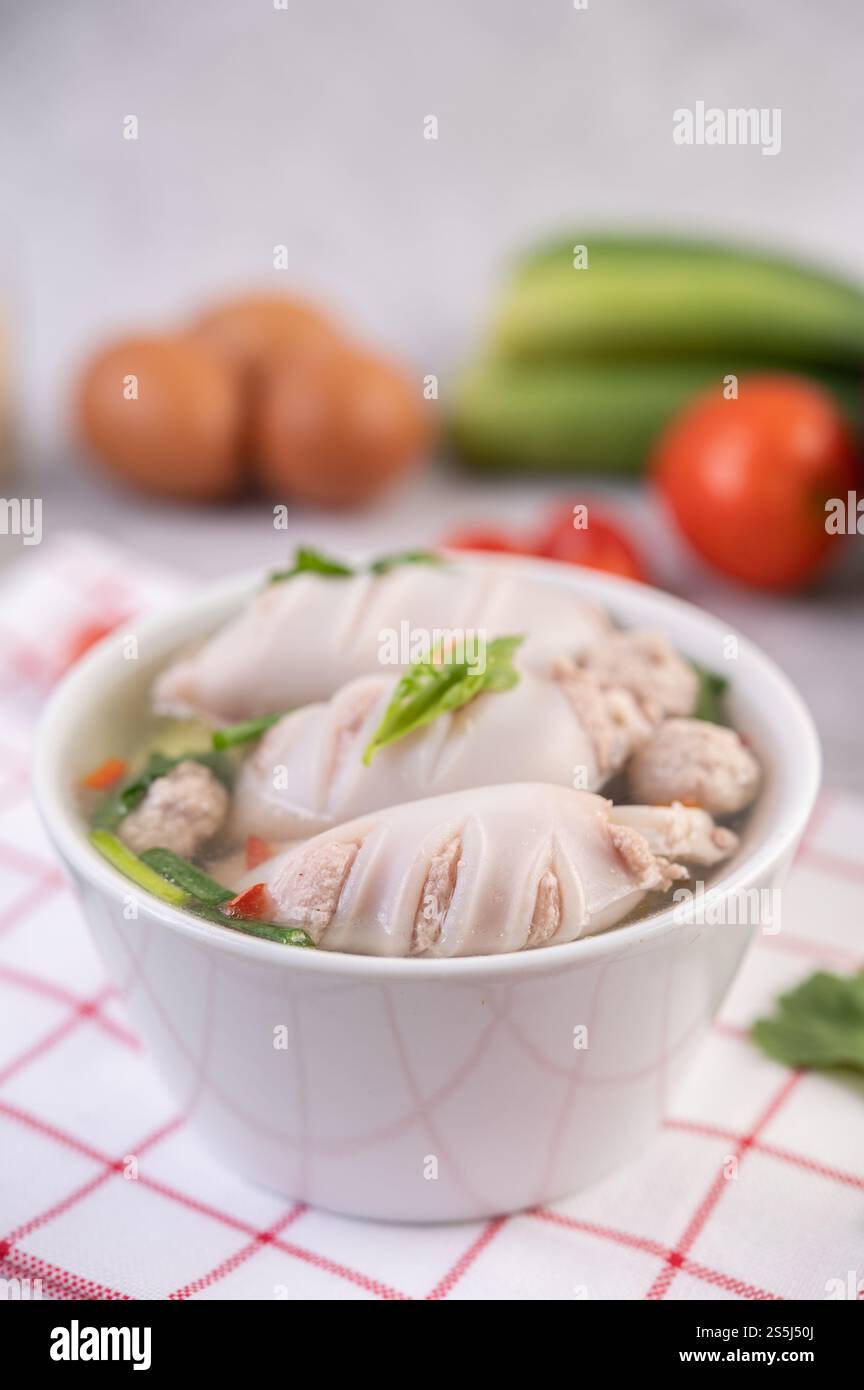 Squid soup stuffed with pork, sprinkled with coriander and chopped ...