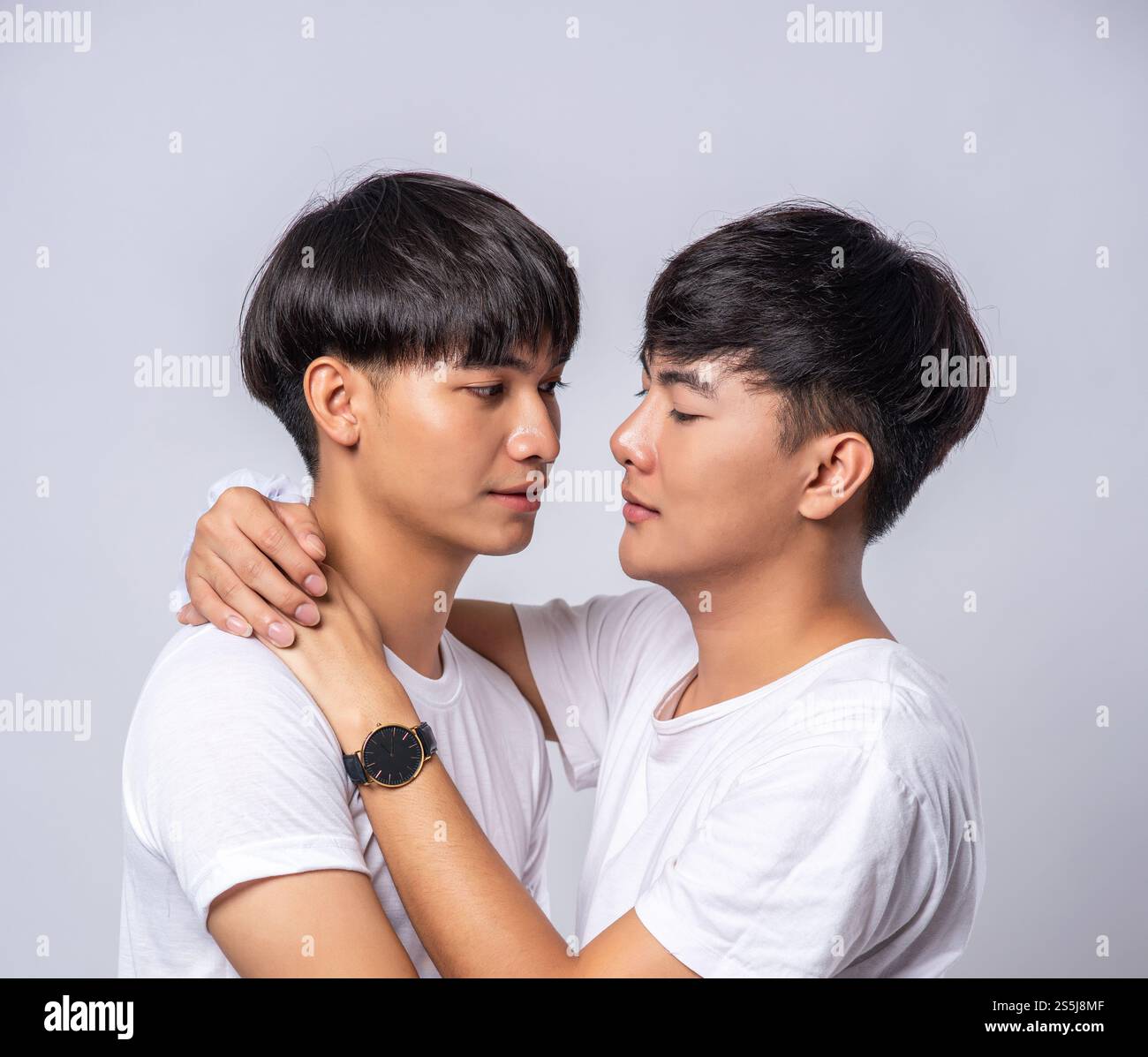 Two men who love each other happily hug each other Stock Photo - Alamy