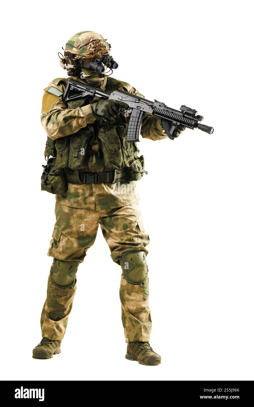 Armed soldier in camouflage and tactical gear equipped with weaponry ...