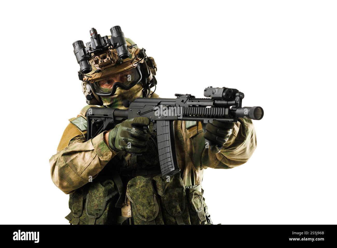 A combat-ready soldier in full military gear and tactical wear aiming ...