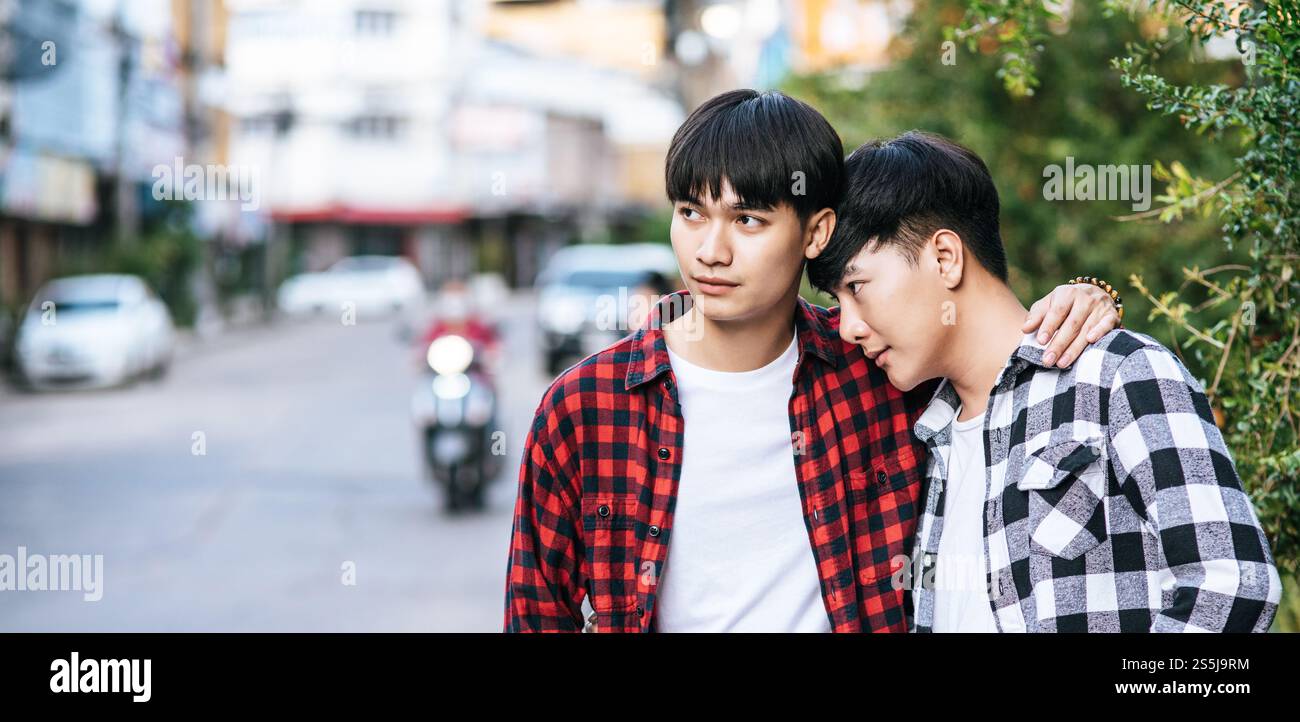 Two men who love each other happily hug each other Stock Photo - Alamy