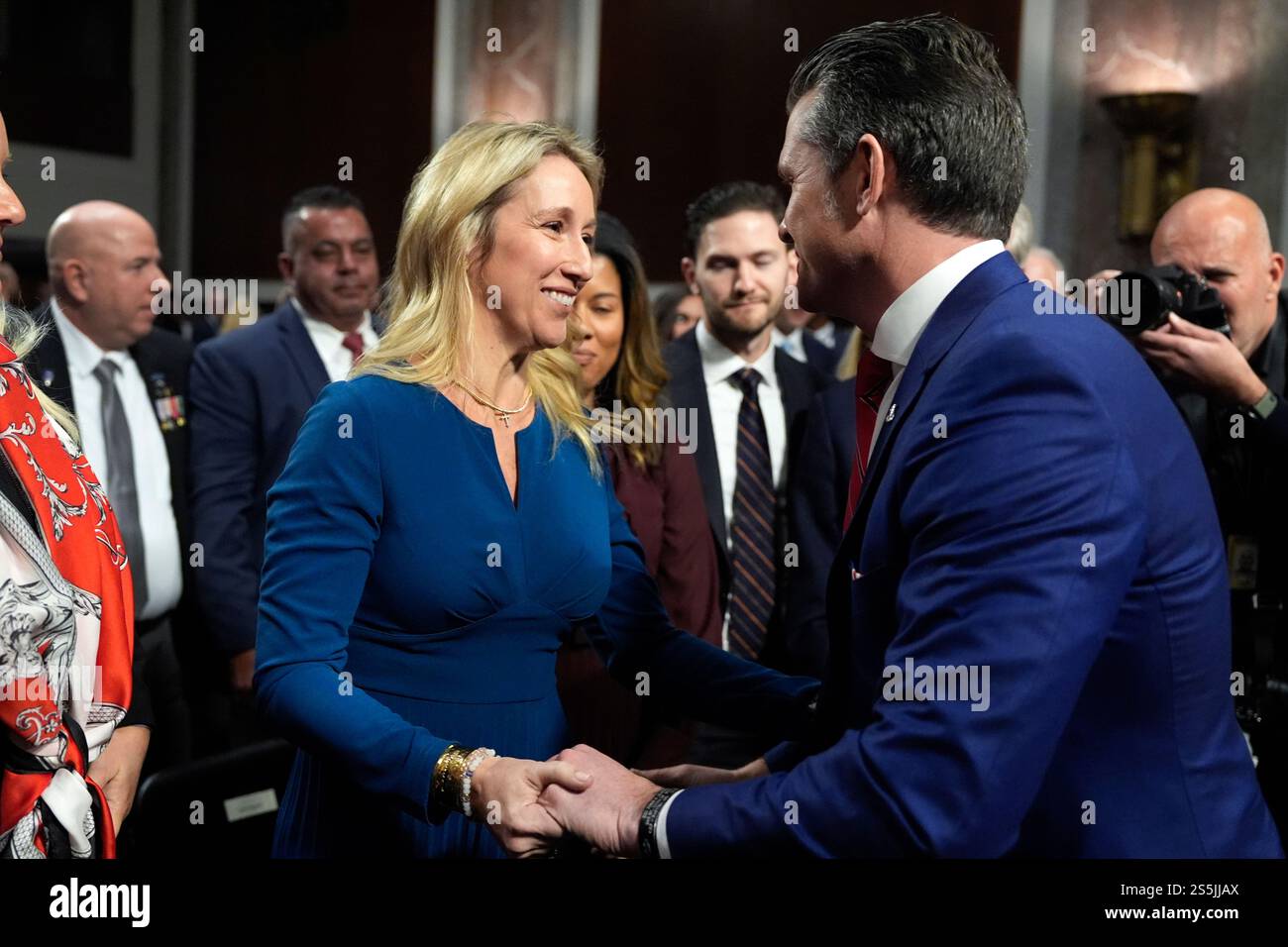 Jennifer Rauchet hugs her husband Pete Hegseth, President-elect Donald ...