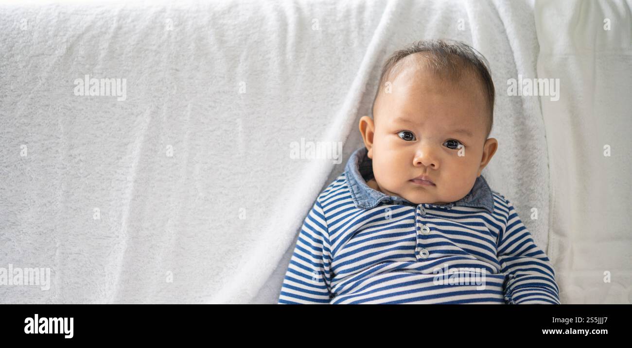 A newborn baby who opens his eyes and looks forward Stock Photo - Alamy