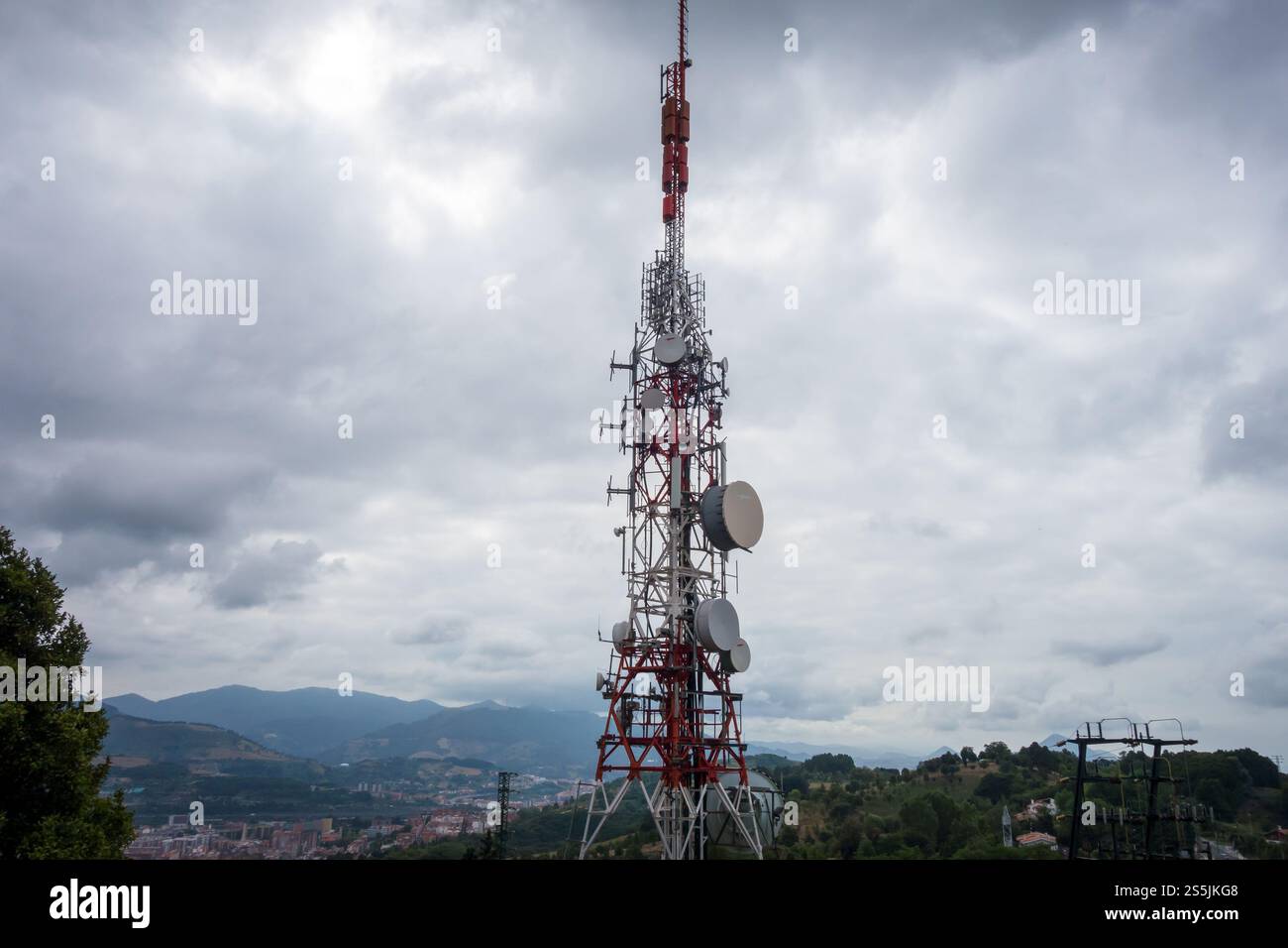 Television and phone antenna. Big red and white tower. Television and ...
