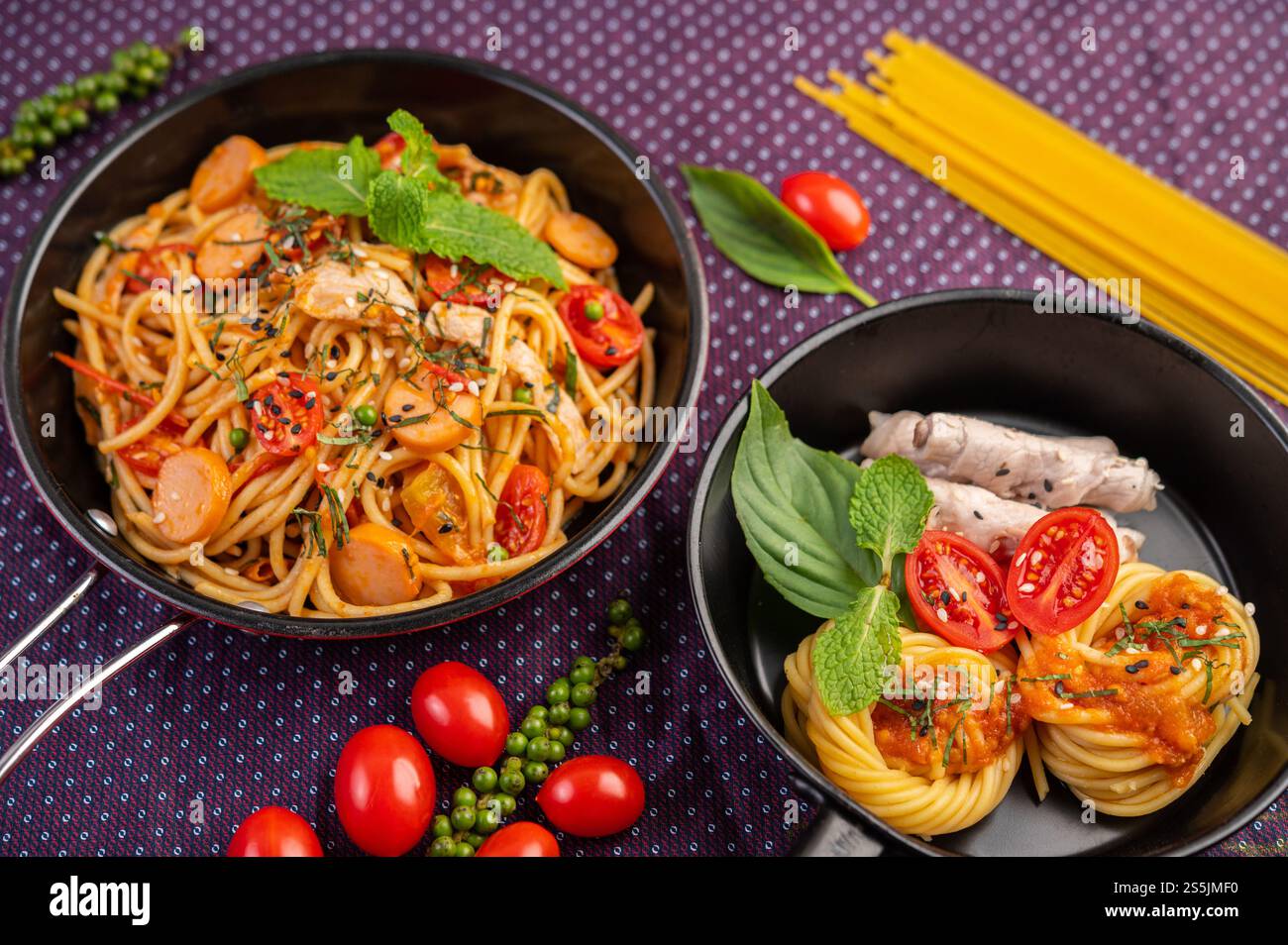 Spicy Spaghetti in a Pan With tomatoes and paghetti Stock Photo - Alamy