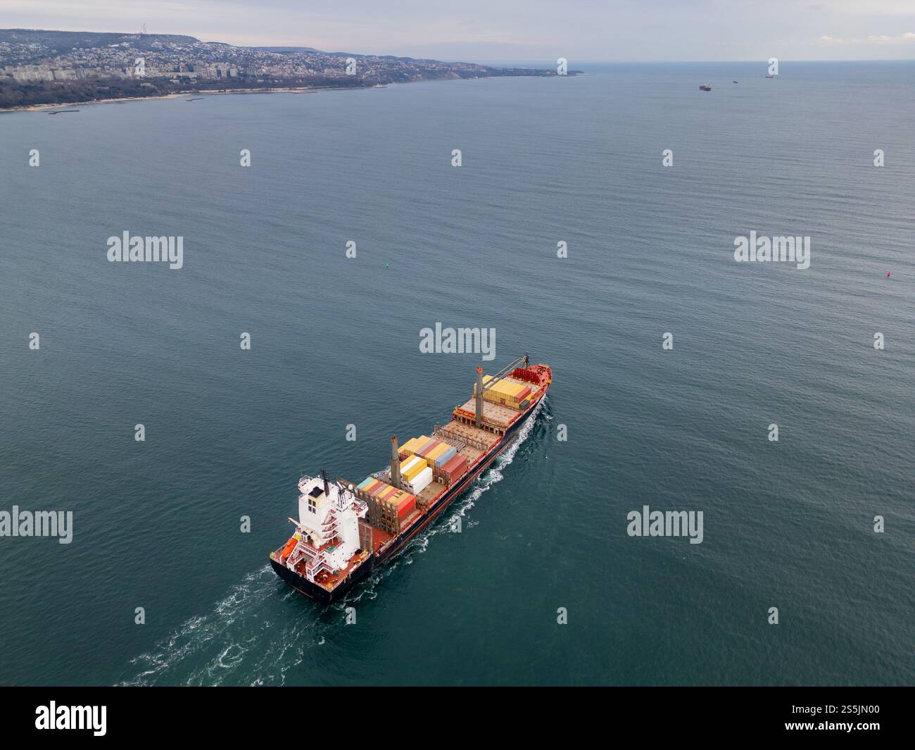 Aerial view of a cargo ship entering the port of Varna, Bulgaria. The ...