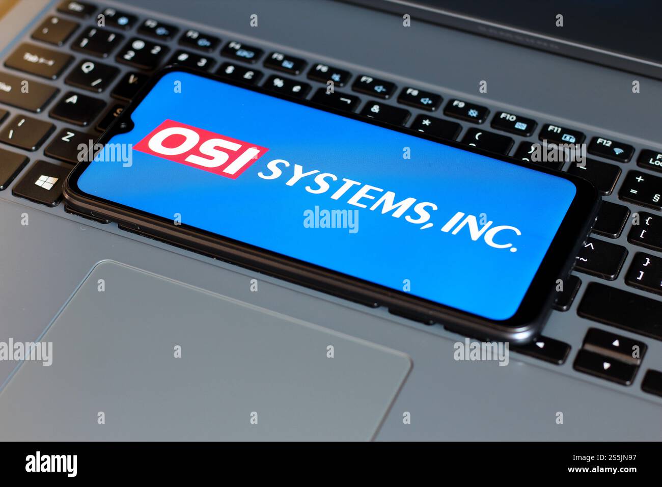 In this photo illustration, the OSI Systems logo is seen displayed on a ...