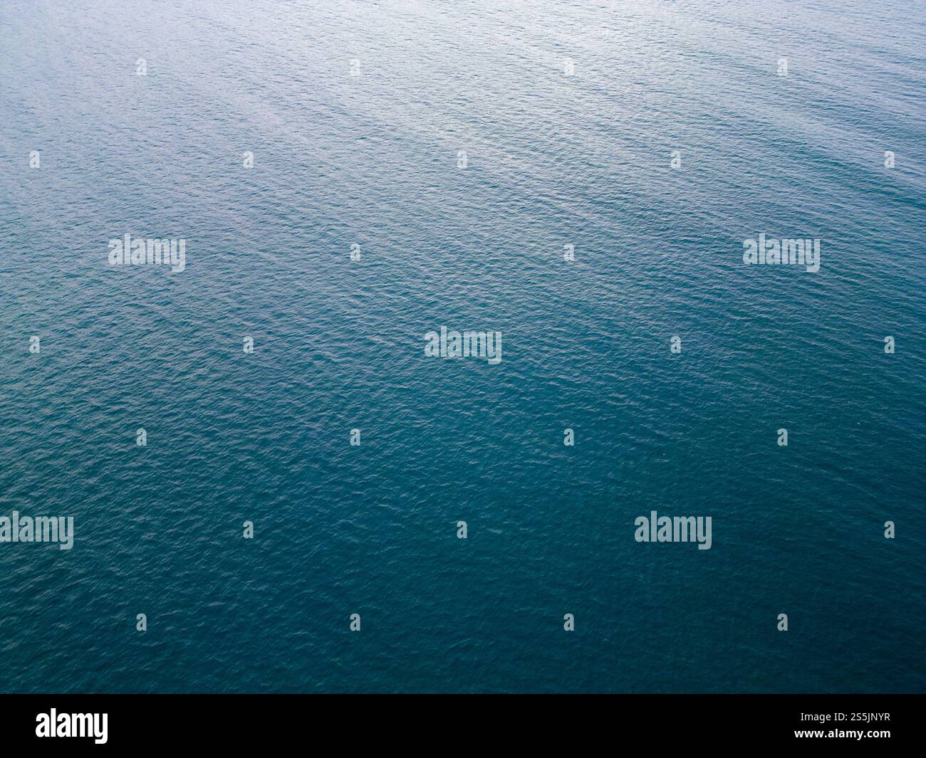 Aerial view of calm Sea waters. The surface of the water forms a ...