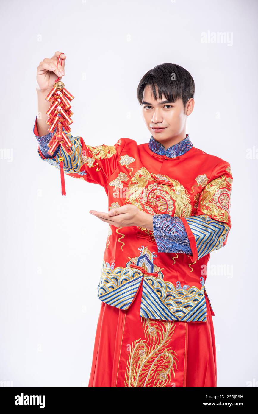 Man wear Cheongsam smile to get Firecrackers from boss in chinese new ...