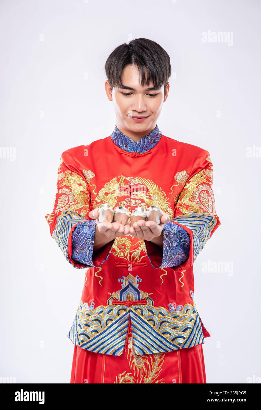 Man wear Cheongsam suit smile and standing to give the gift money to ...