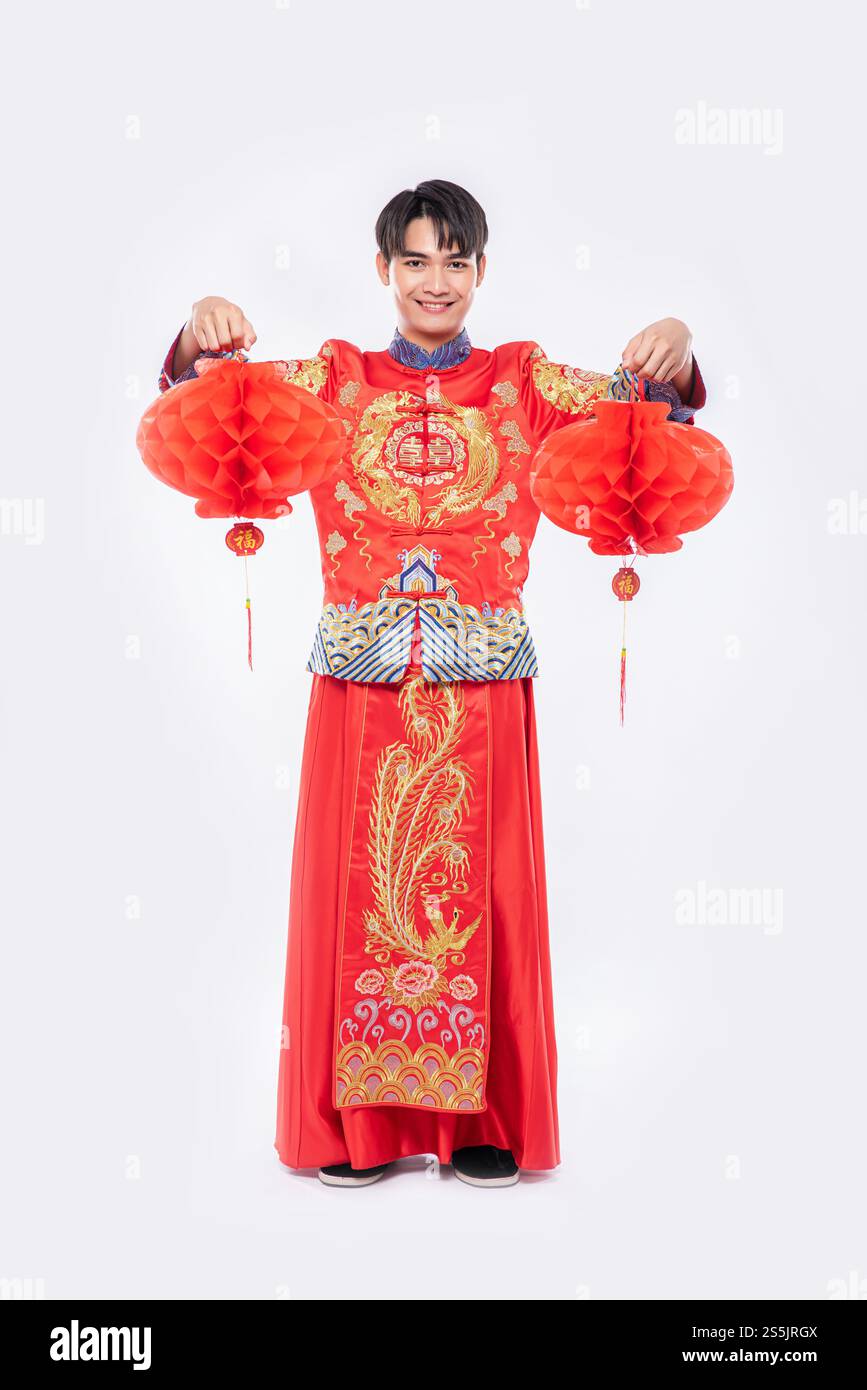 Man wear Cheongsam suit show decorate red lamp to his shop in chinese ...