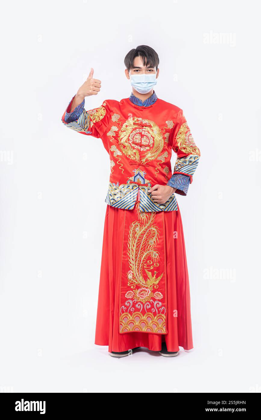 Man wear Cheongsam suit and mask show the best way to shopping for ...